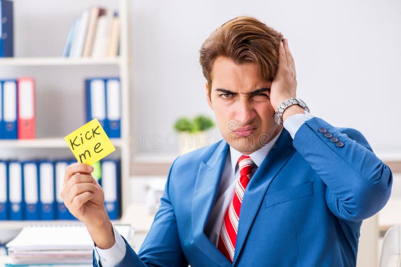 The Office Prank with Kick Me Message on Sticky Note Stock Photo ...