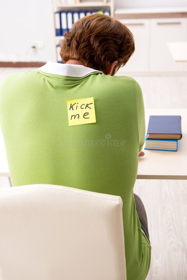The Office Prank with Kick Me Message on Sticky Note Stock Image ...