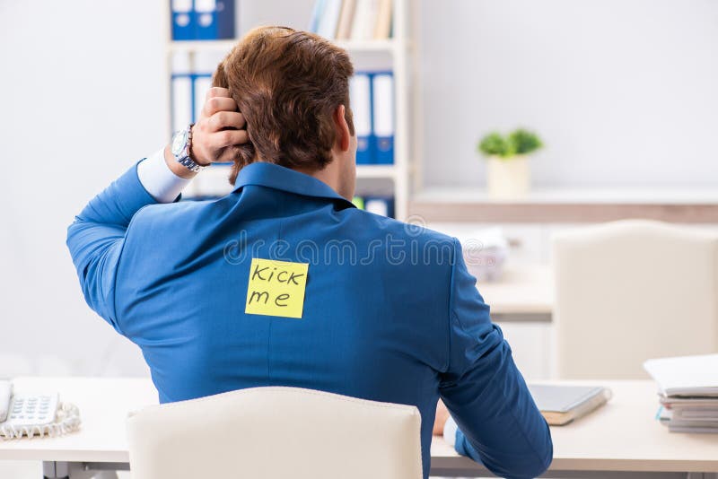 The Office Prank with Kick Me Message on Sticky Note Stock Image ...