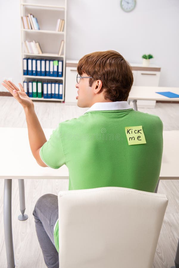 The Office Prank with Kick Me Message on Sticky Note Stock Photo ...