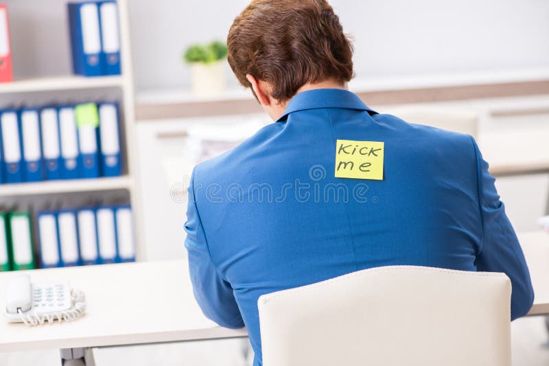 The Office Prank with Kick Me Message on Sticky Note Stock Photo ...