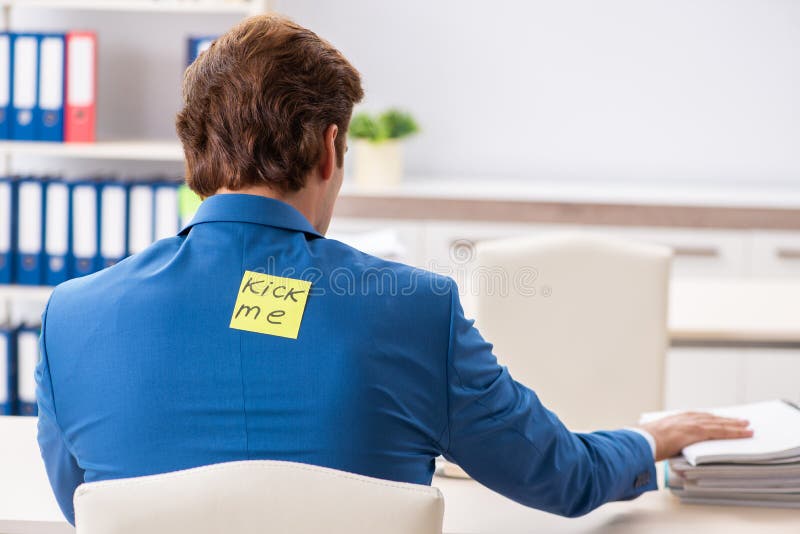 The Office Prank with Kick Me Message on Sticky Note Stock Image ...