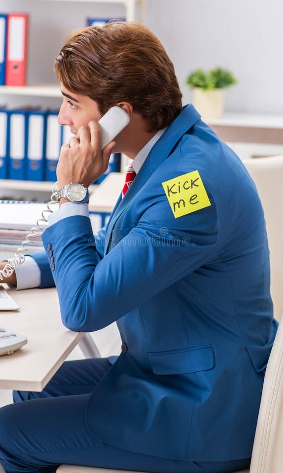 Office Prank with Kick Me Message on Sticky Note Stock Image - Image of ...