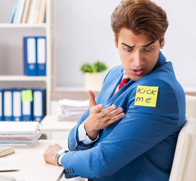 Office Prank with Kick Me Message on Sticky Note Stock Image - Image of ...