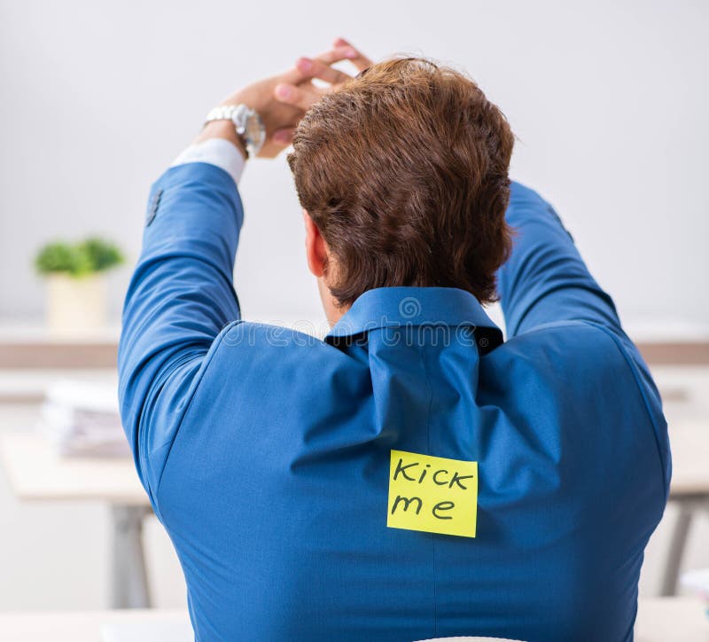 Office Prank with Kick Me Message on Sticky Note Stock Image - Image of ...