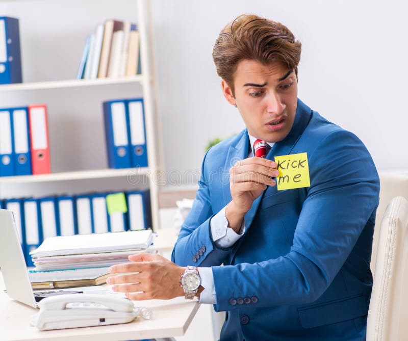 Office Prank with Kick Me Message on Sticky Note Stock Image - Image of ...