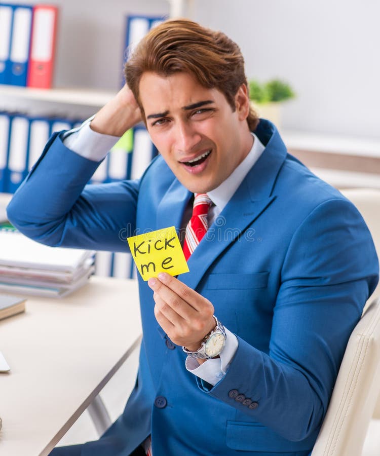The Office Prank with Kick Me Message on Sticky Note Stock Image ...