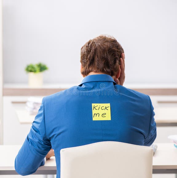 Office Prank with Kick Me Message on Sticky Note Stock Image - Image of ...