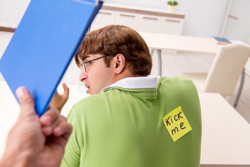 The Office Prank with Kick Me Message on Sticky Note Stock Image ...