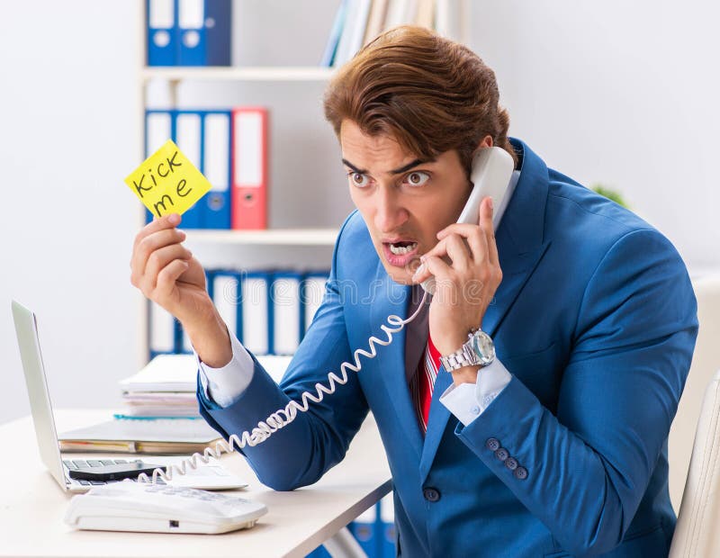Office Prank with Kick Me Message on Sticky Note Stock Image - Image of ...