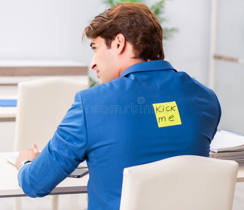 The Office Prank with Kick Me Message on Sticky Note Stock Image ...