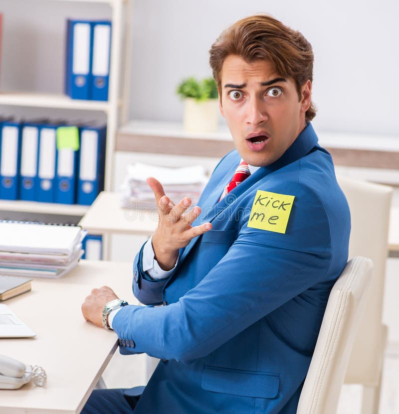 Office Prank with Kick Me Message on Sticky Note Stock Image - Image of ...