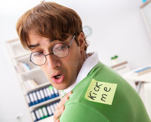 Office Prank with Kick Me Message on Sticky Note Stock Image - Image of ...