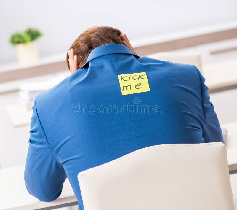 Office Prank with Kick Me Message on Sticky Note Stock Photo - Image of ...