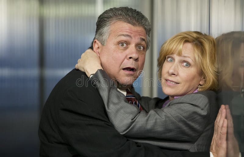 Co-workers Kissing in Office Cubicle Stock Photo - Image of couple ...