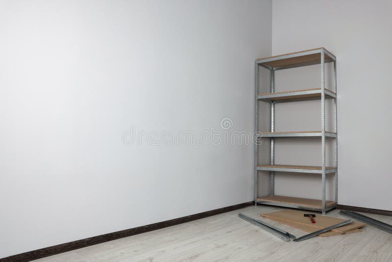 Office Room with White Walls and Metal Storage Shelf. Space for Text ...
