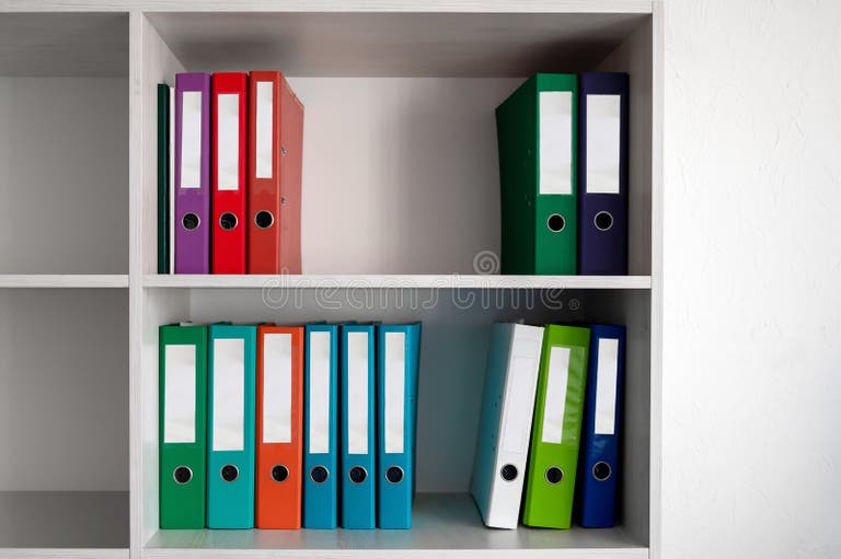 Office Shelves with Colorful Folders. Folders on the Shelves in the ...