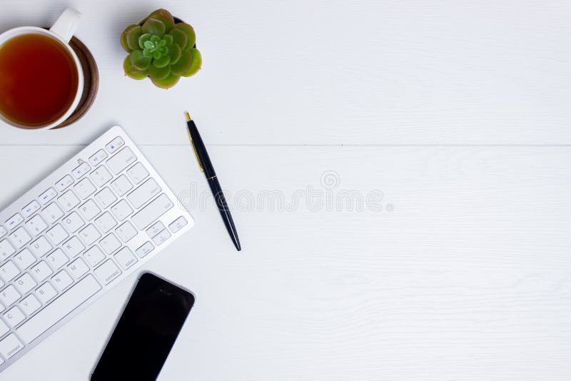 Office Space with Computer, Coffee, Mobile Phone, Pen and Cactus Over ...