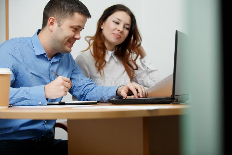 Office Staff Sitting at Desk Stock Photo - Image of sitting, looking ...
