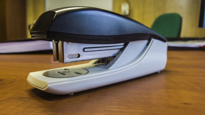 An Office Stapler on a Desk Stock Image - Image of pencil, desk: 140910047
