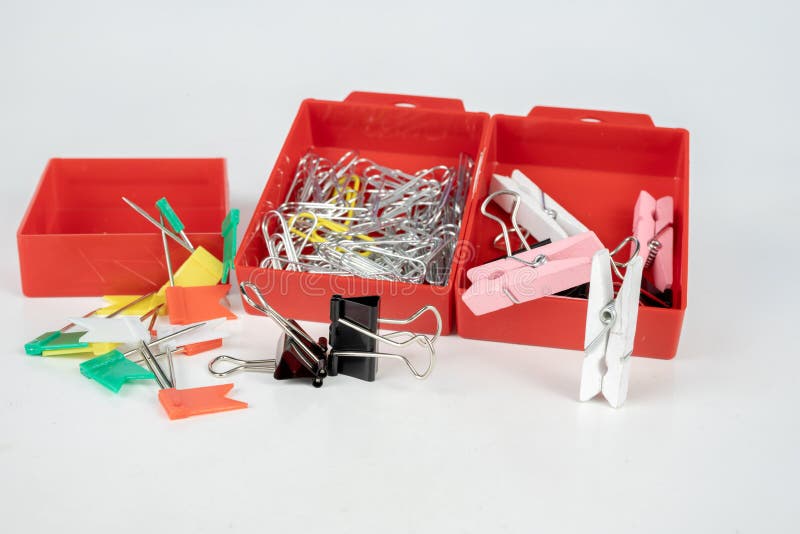 Office Supplies on a White Table. Paper Clips and Clips for Office Use ...