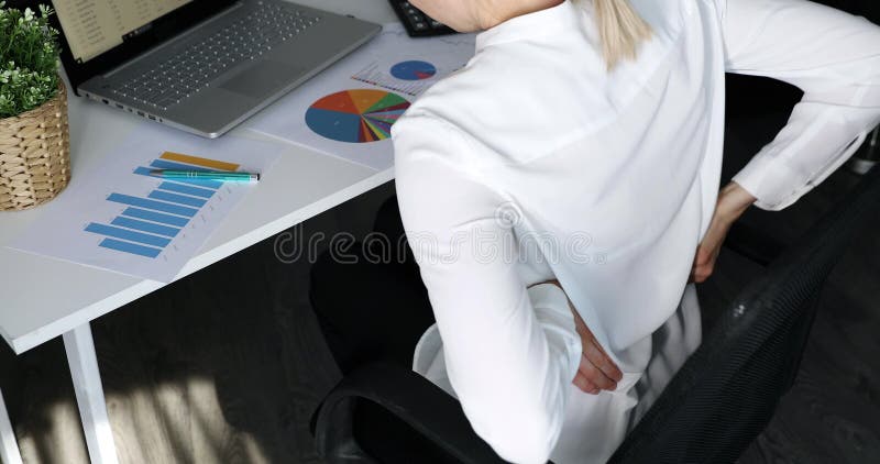 Office Syndrome - Woman Suffering from Back Pain while Working with ...