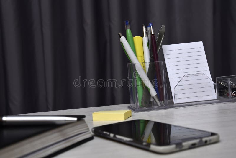Office Table with Cell Phone Pens and Notepad Work Area Stock Photo ...