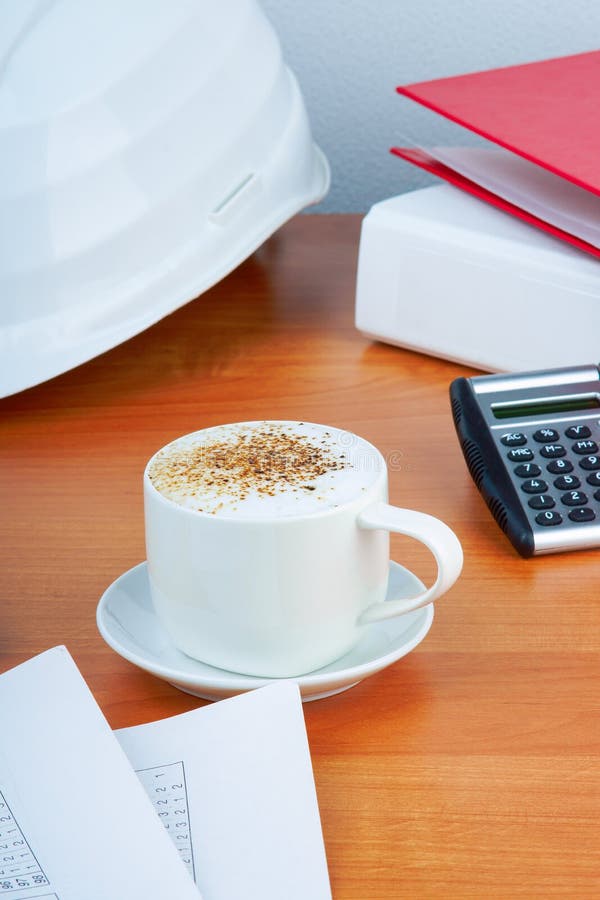 Office Table with Coffee Cup , Work Essential Tools and White Hard Hat ...