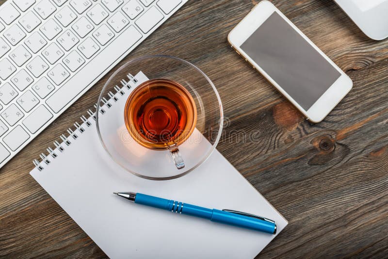 Office Table with Computer Keyboard and Cup of Tea Stock Photo - Image ...