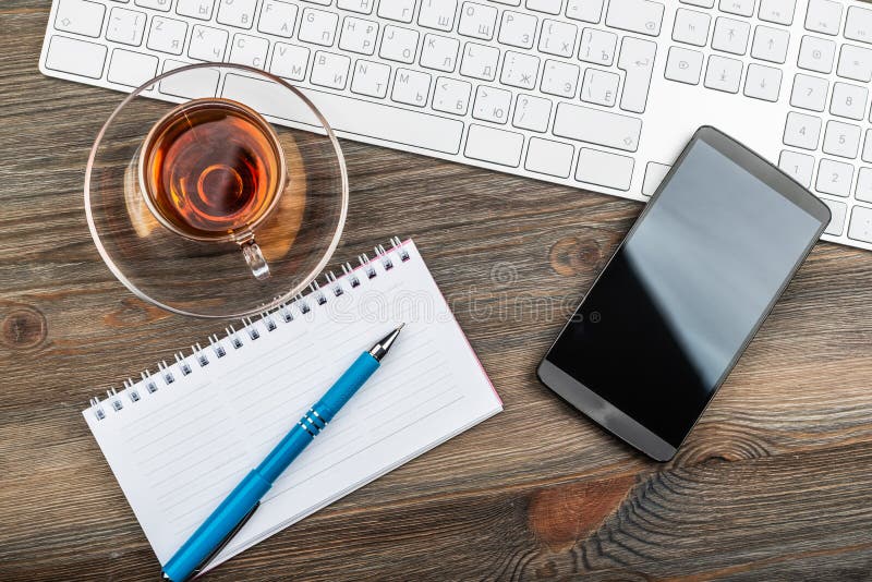Office Table with Computer Keyboard and Cup of Tea Stock Photo - Image ...