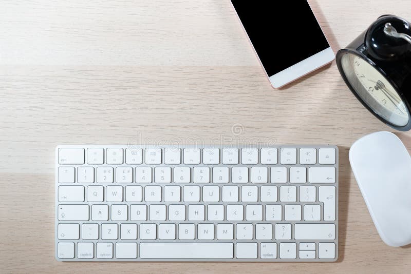 Office Table with Computer Keyboard, Mouse, Smartphone and Alarm Clock ...