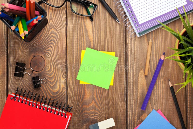 Office Table with Flower, Supplies and Blank Post it Stock Image ...