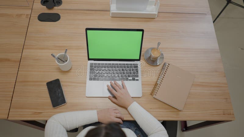 Office Table with Green Screen Laptop Computer and Female Hands Taping ...