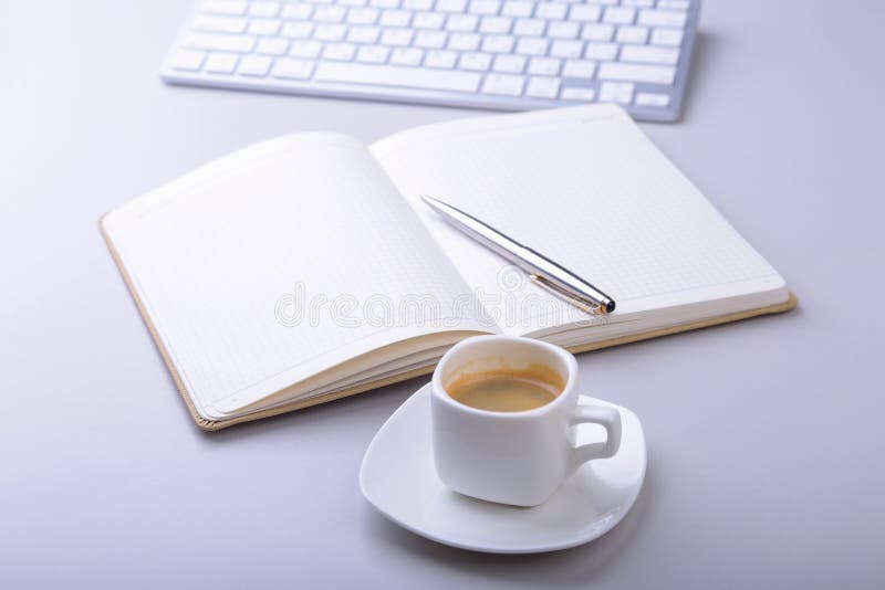 Office Table with Notebook, Ballpoint Pen, Computer Keyboard, Cup of ...