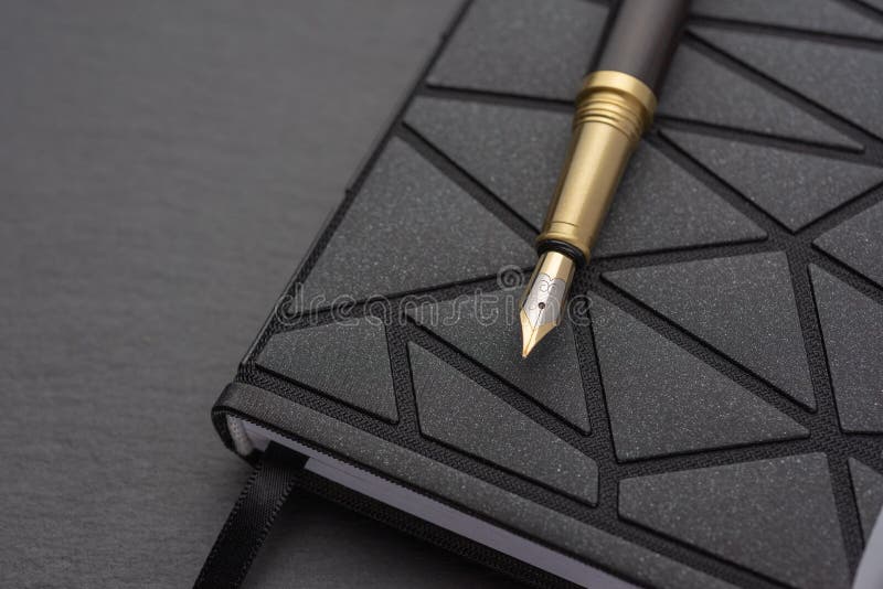 Office Table with Notepad. Fountain Pen with Black Handle Stock Image ...