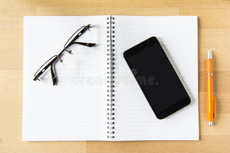 Office Table, Notepad, Smart Phone, Pen and Glasses Stock Photo - Image ...