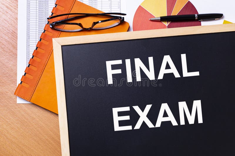 On the Office Table is an Orange Notepad, Black Glasses, a Pen and a ...