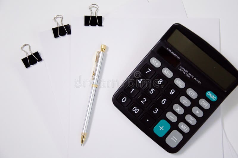 Office Table with Pen, Calculator and Empty Paper Stock Photo - Image ...