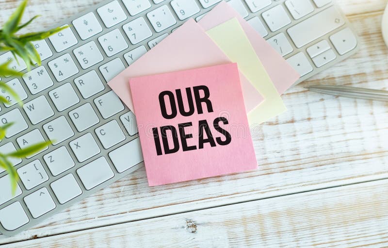 Office Table with Pen, Keyboard and Empty Paper with OUR IDEAS Text ...