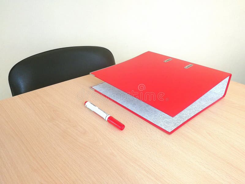 Office. Table. on the Table is a Red Folder and a Red Marker Stock ...