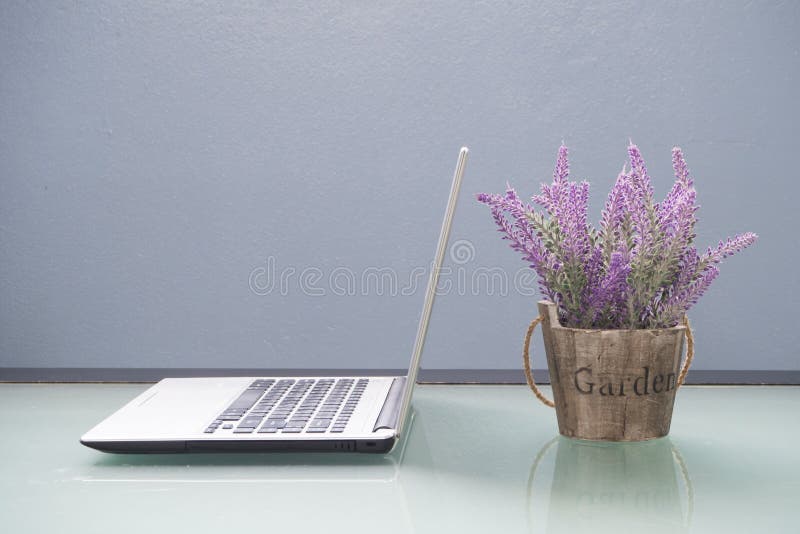 Office Table with Violet Flower on Pot. Stock Photo - Image of screen ...