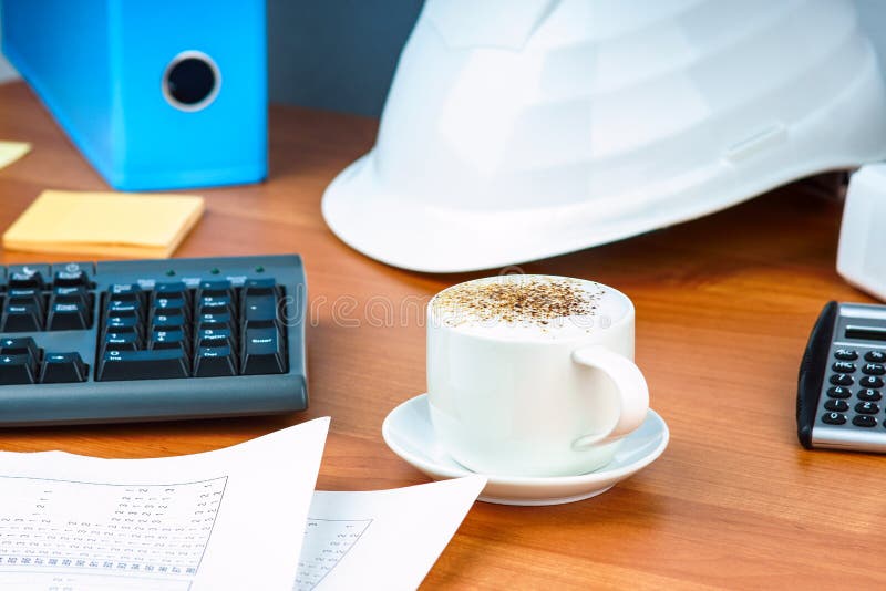 Office Table with Work Essential Tools and Hard Hat Stock Photo - Image ...