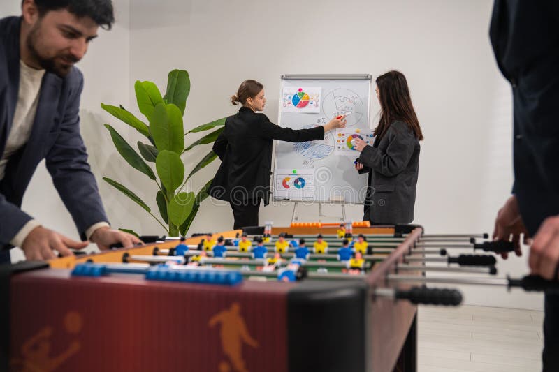 Office Team Collaborating on Innovative Strategy while Enjoying Break ...