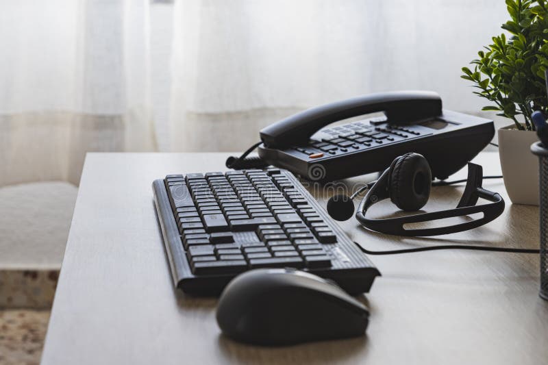 An Office Telephone Nest To Black Computer Keyboard and Mouse are on a ...