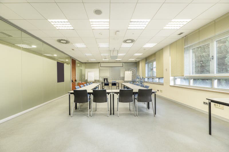 Office with a Training Room with a U-shaped Table Full of Chairs ...