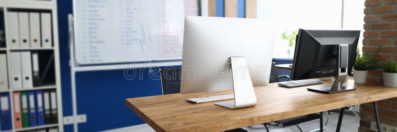 An Office in Which Desk is Computers White Information Board and ...