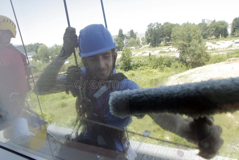 Office window washer editorial stock photo. Image of mirror - 77317653