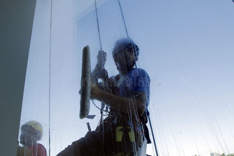 Office window washer editorial stock image. Image of business - 77317729