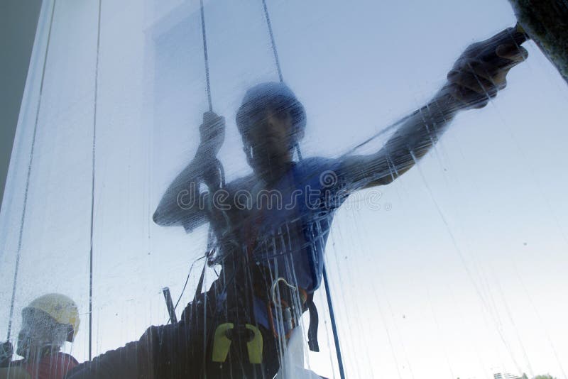 Office window washer editorial stock photo. Image of mirror - 77317653