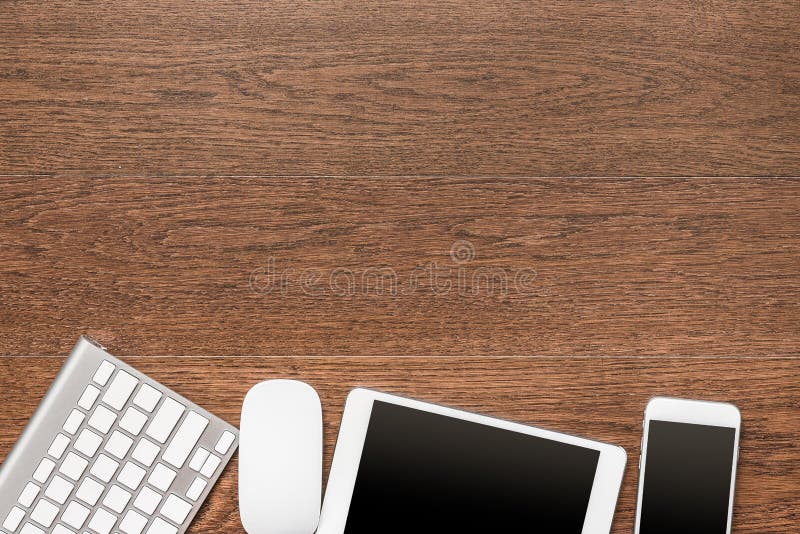Office Wooden Table with Tablet, Keyboard, Mouse and Smartphone Stock ...